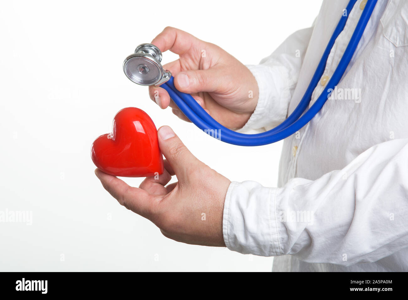 young mail doctor holding red heart in his hand Stock Photo - Alamy