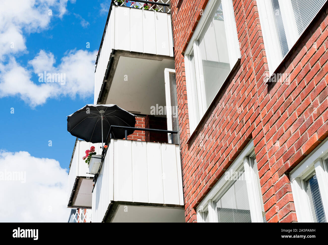 Parasol on balcony Stock Photo - Alamy