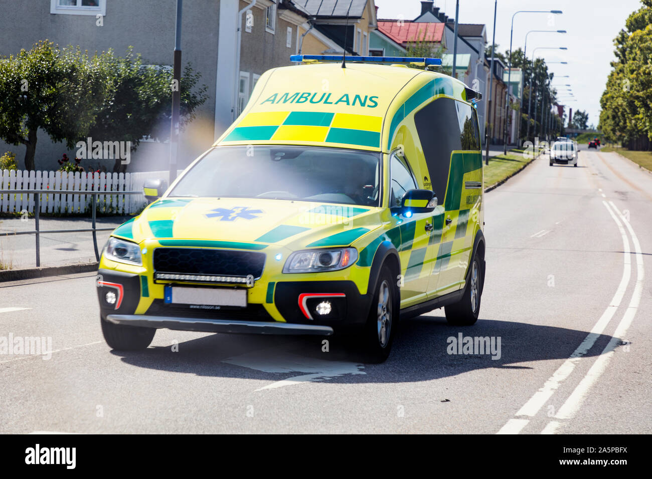 Ambulance on street Stock Photo - Alamy