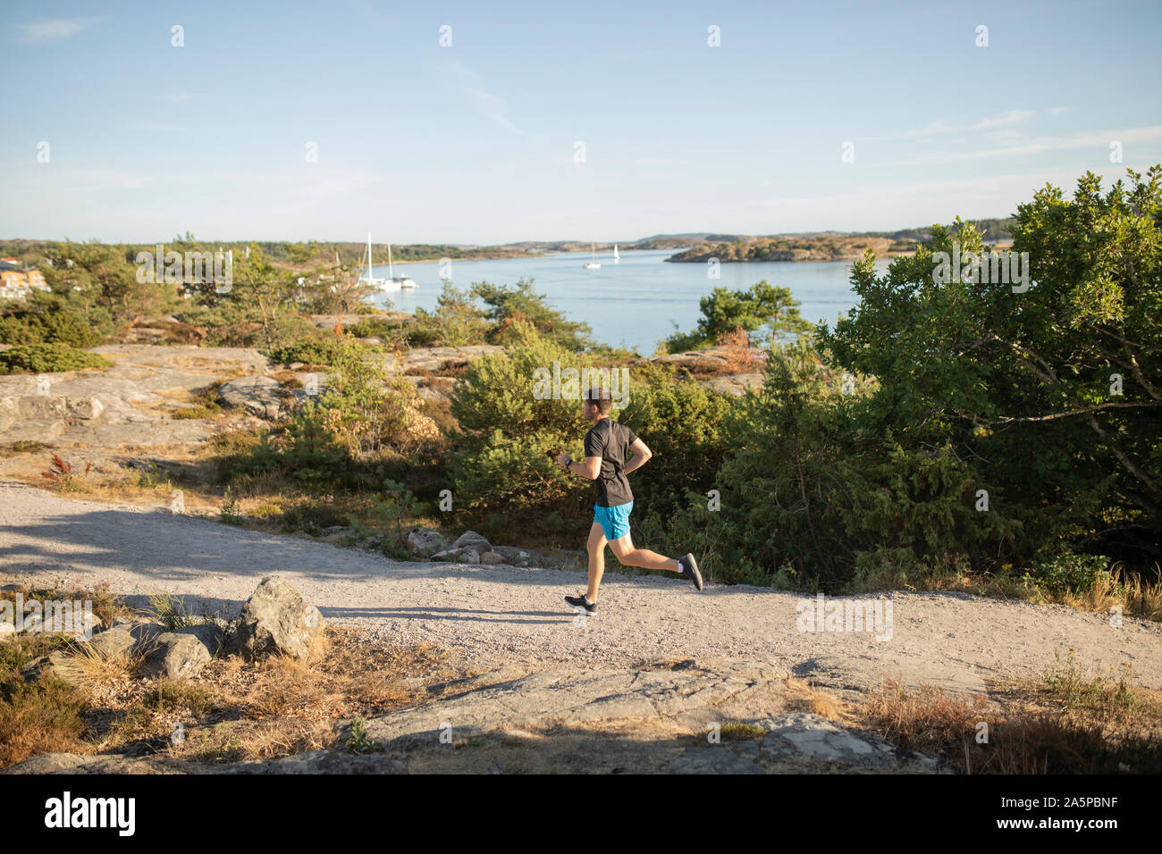 Sports man running near hi-res stock photography and images - Alamy