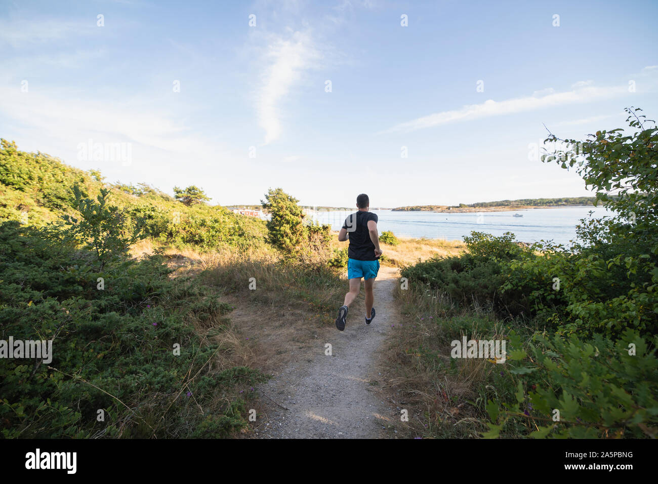 Sports man running near hi-res stock photography and images - Alamy