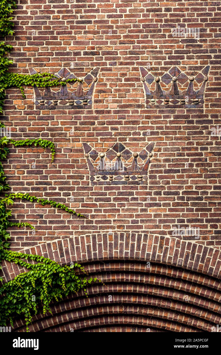 Brick wall with crowns Stock Photo - Alamy