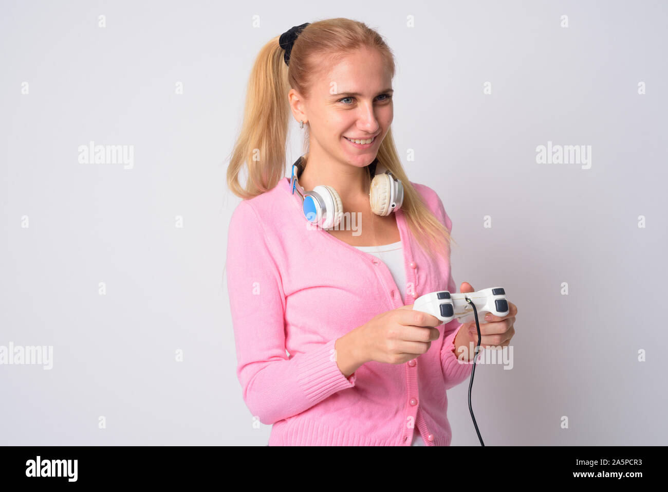 Portrait of young blonde nerd woman playing games Stock Photo - Alamy