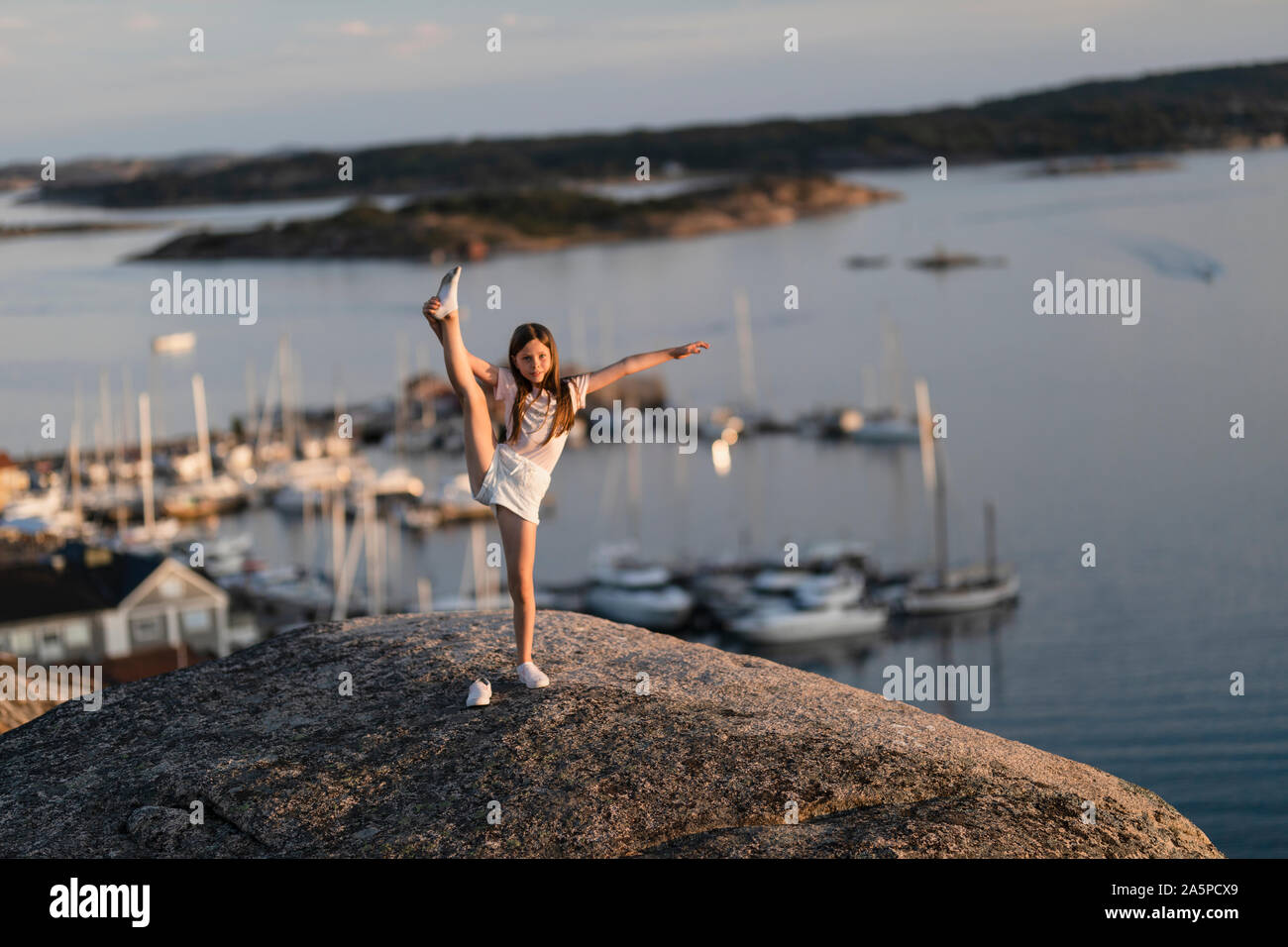 Girl standing on one leg Stock Photo - Alamy