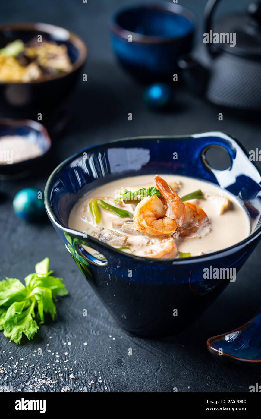 Tom Yum Kung soup, a Thai traditional spicy prawn soup in a bowl on dark background Stock Photo ...