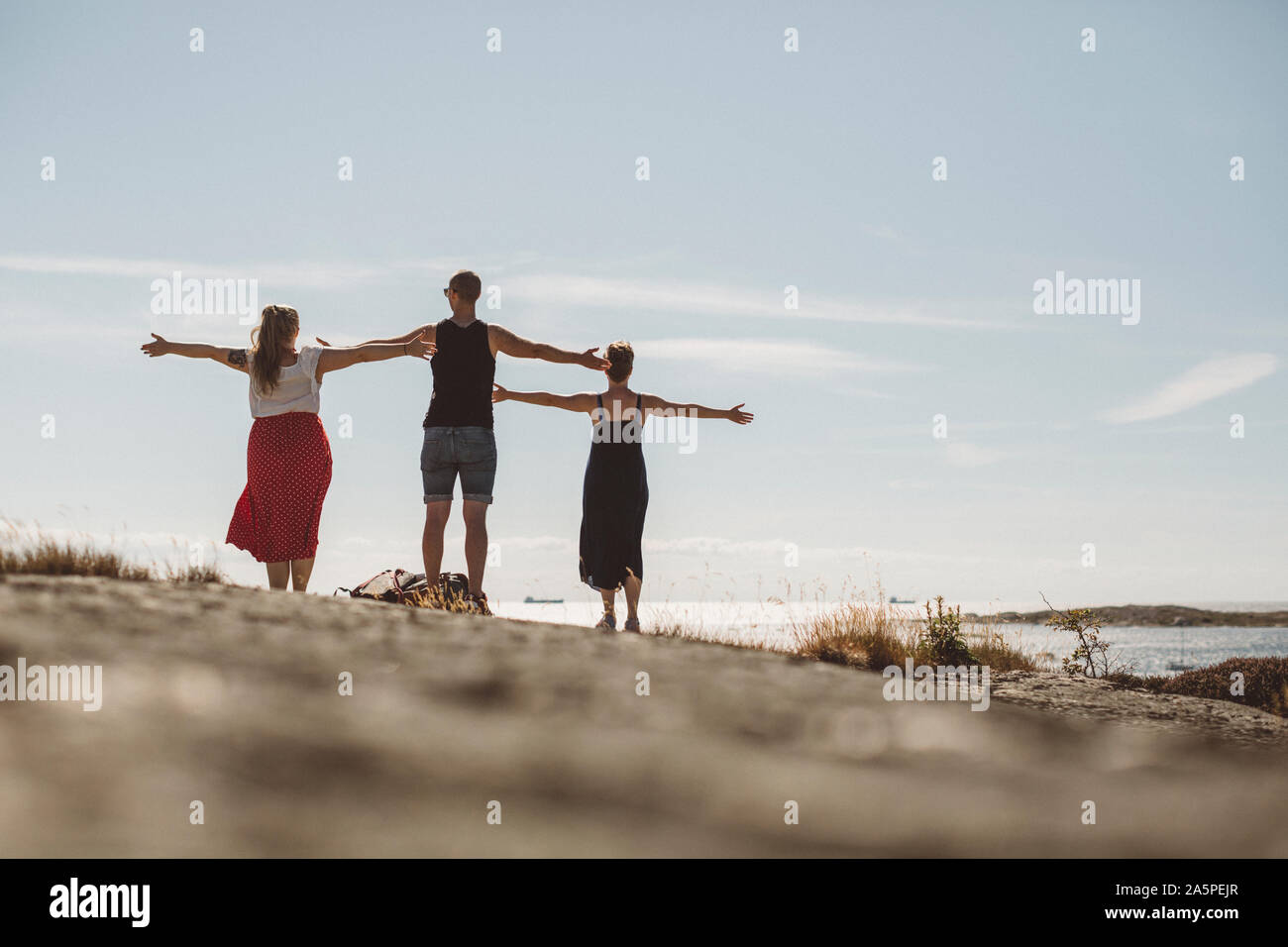 Three friends on beach Stock Photo - Alamy