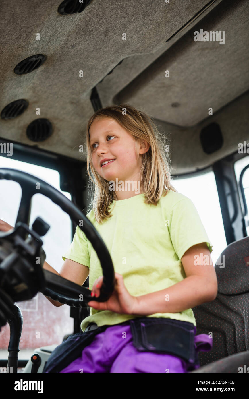Girl driving tractor hi-res stock photography and images - Alamy