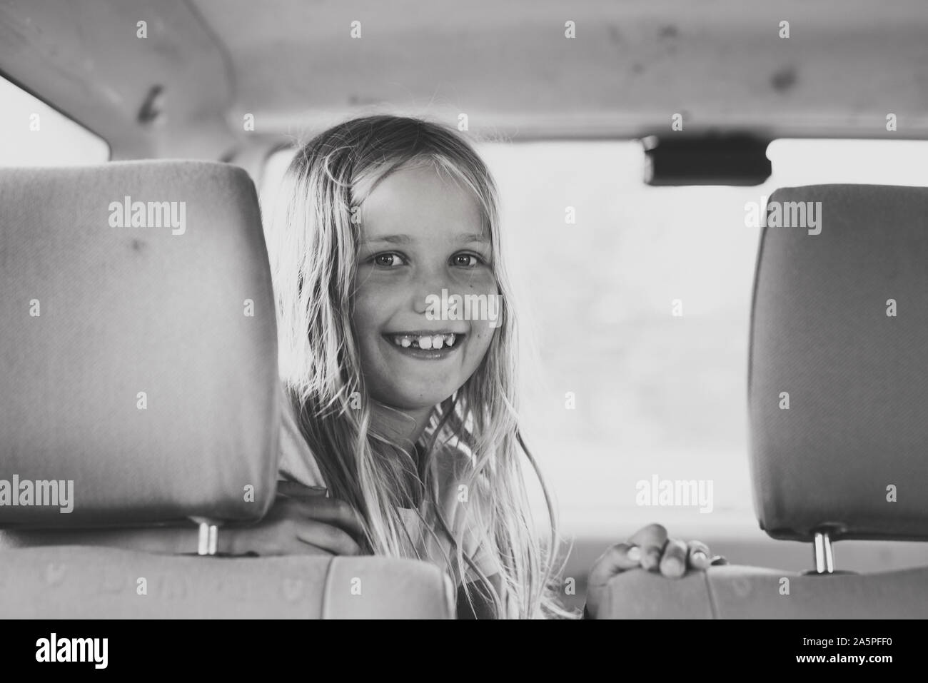 Smiling girl in car Stock Photo - Alamy
