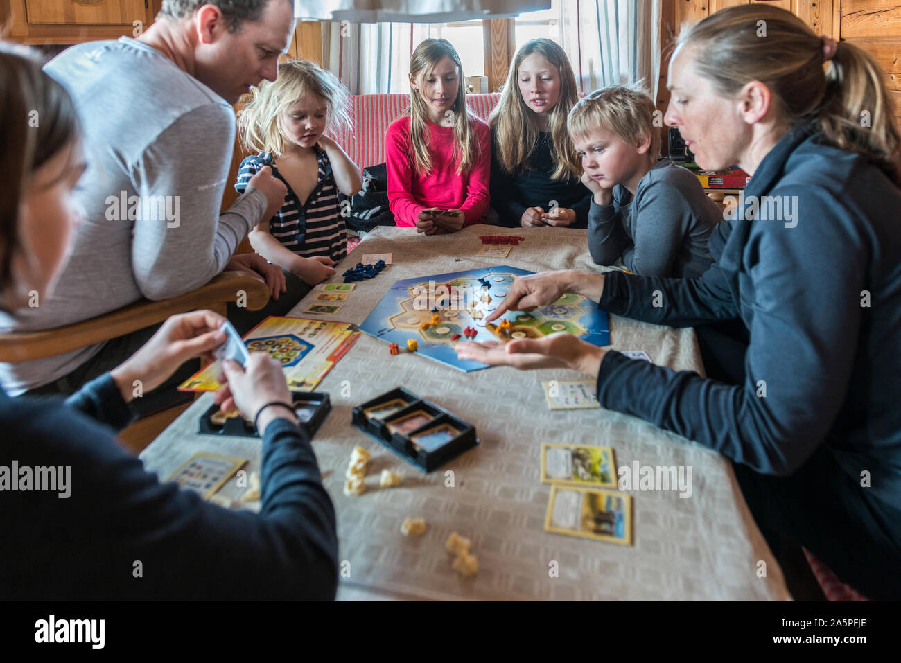 Family playing board game Stock Photo - Alamy