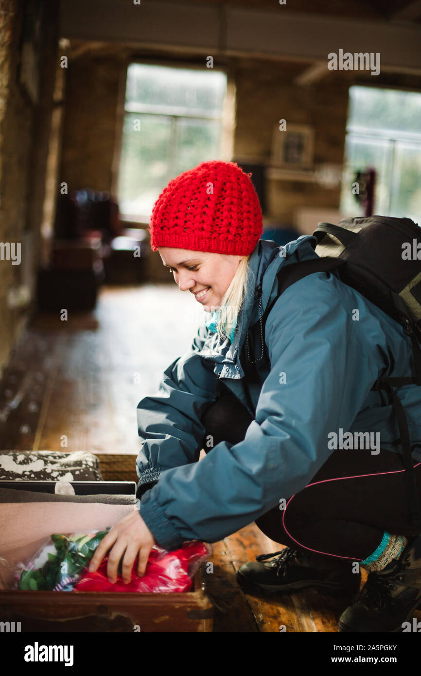 One blonde woman packing suitcase hi-res stock photography and images ...