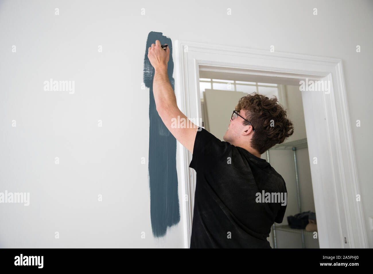 Rear view young man painting hi-res stock photography and images - Alamy