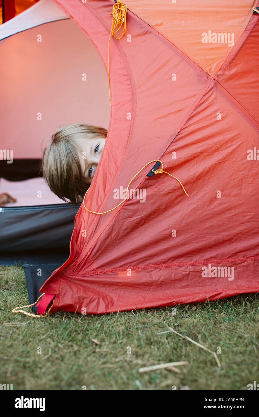 Boy playing in tent Stock Photo - Alamy