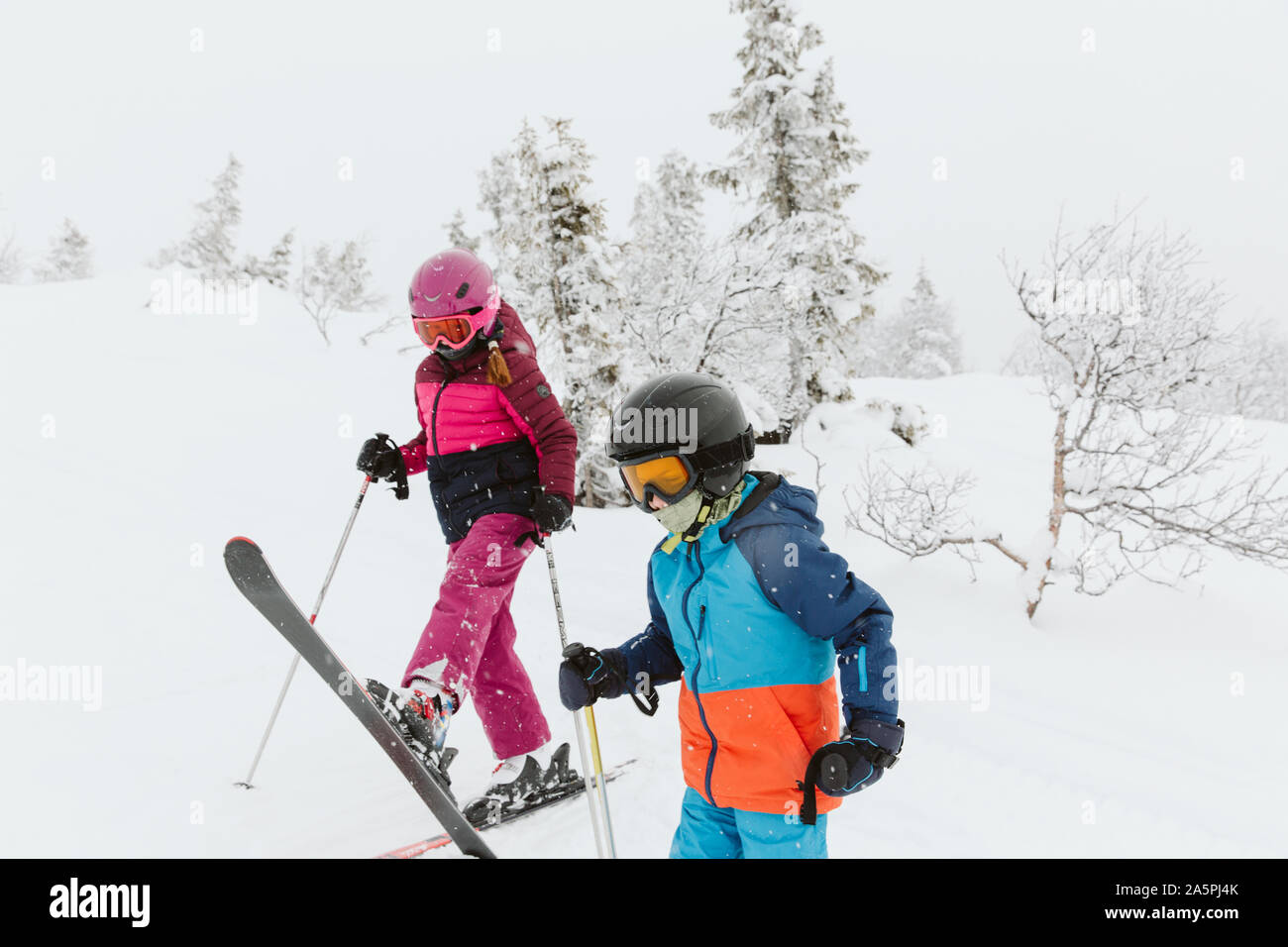Boy girl on skis hi-res stock photography and images - Alamy