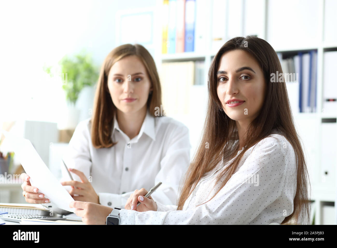 Smart business lady indoors Stock Photo - Alamy
