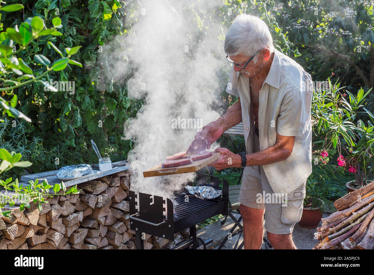 Man making firewood hi-res stock photography and images - Alamy