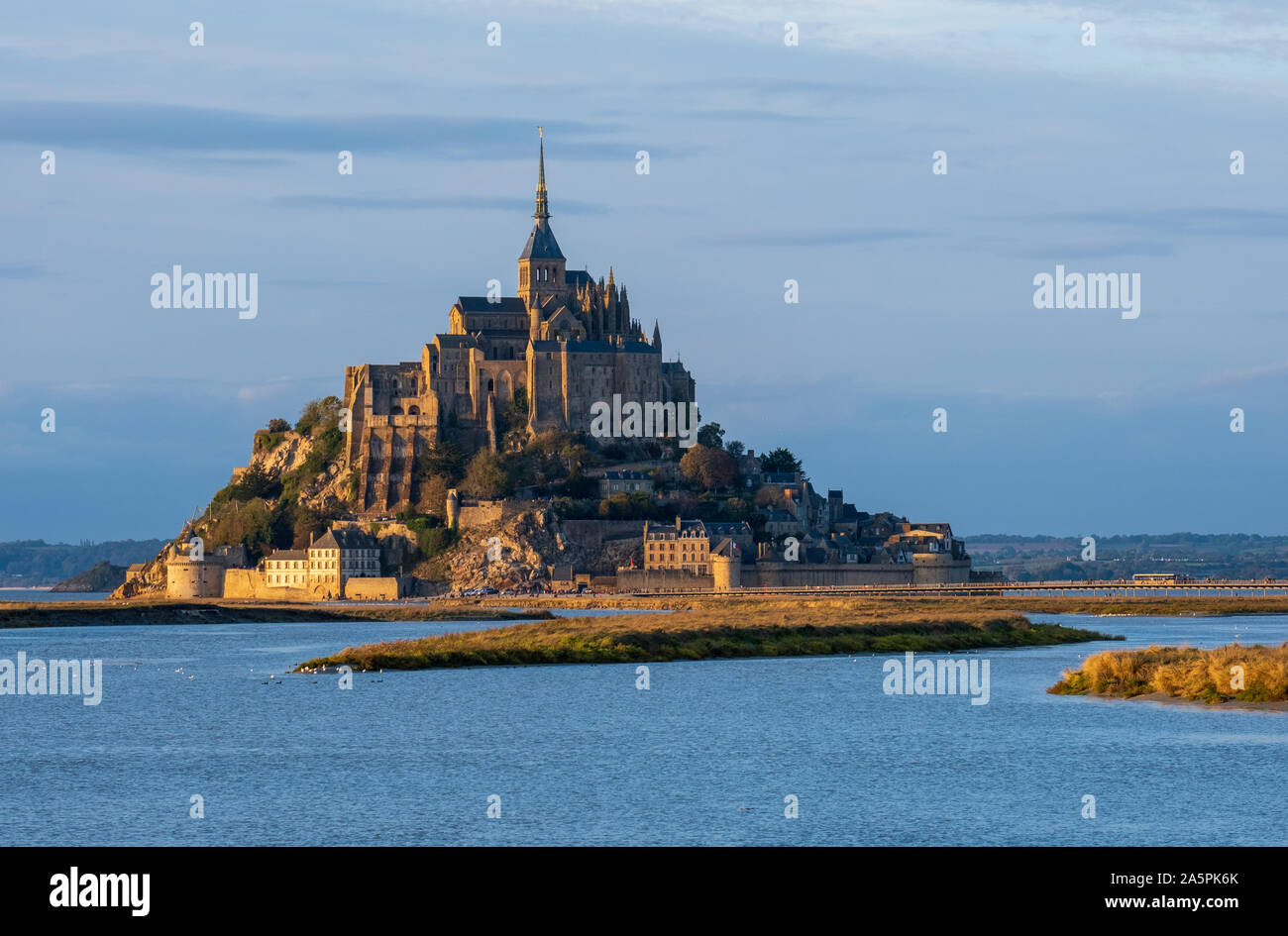 Mont-Saint-Michel with river Couesnon in evening sun, Normandy, France ...