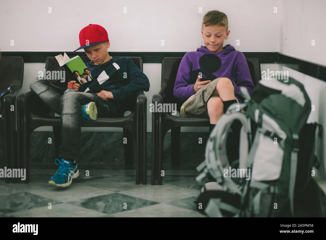 Boys waiting hi-res stock photography and images - Alamy