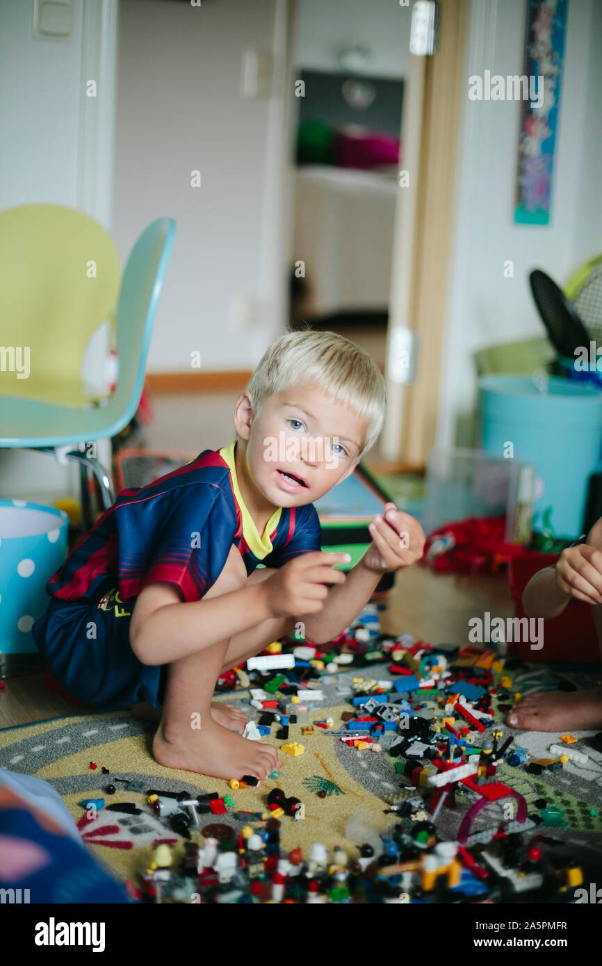 Boy playing Lego Stock Photo - Alamy