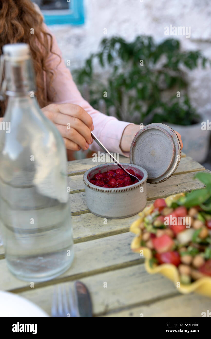 Hand with spoon Stock Photo - Alamy