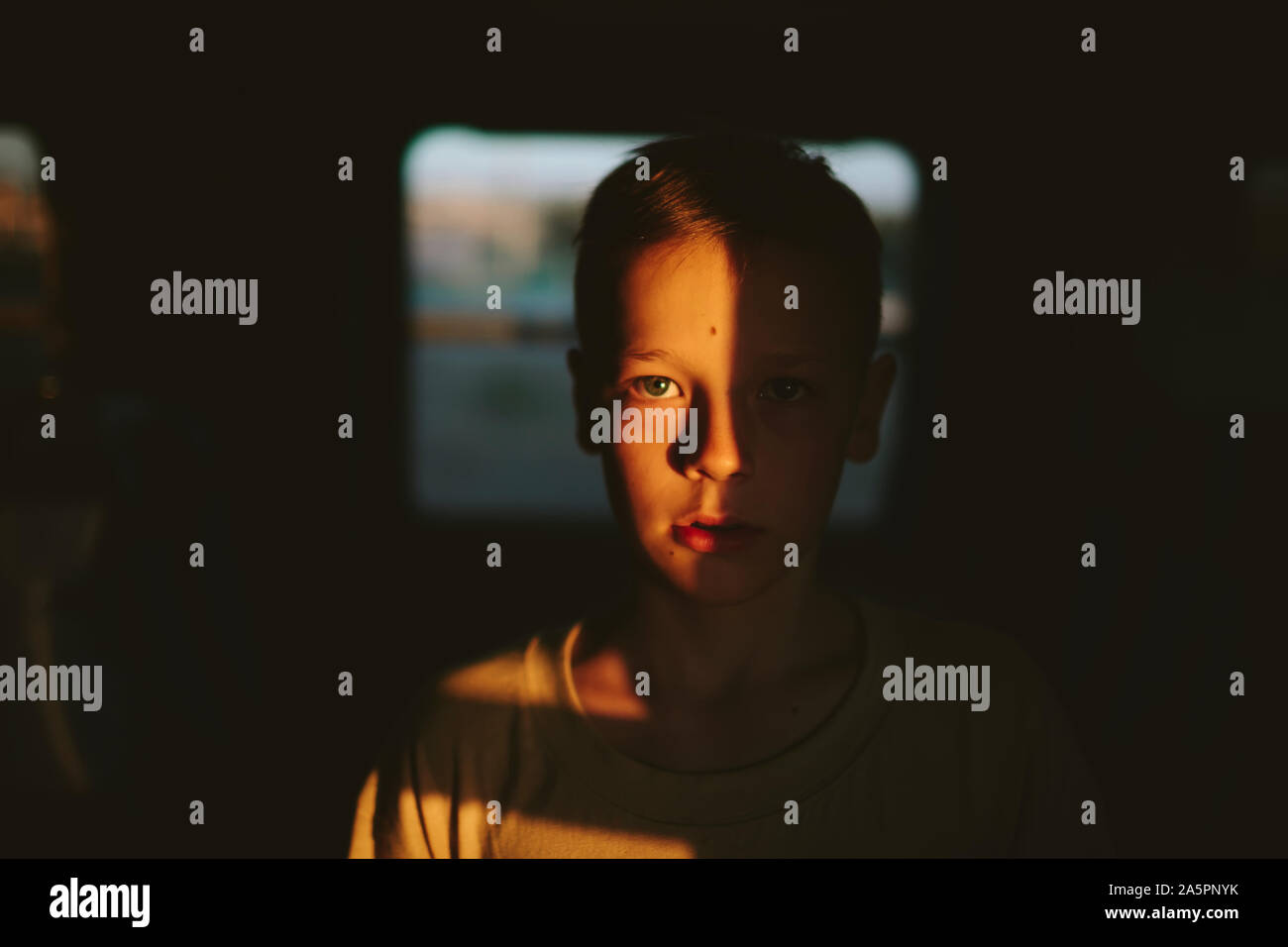 Boy looking at camera Stock Photo - Alamy