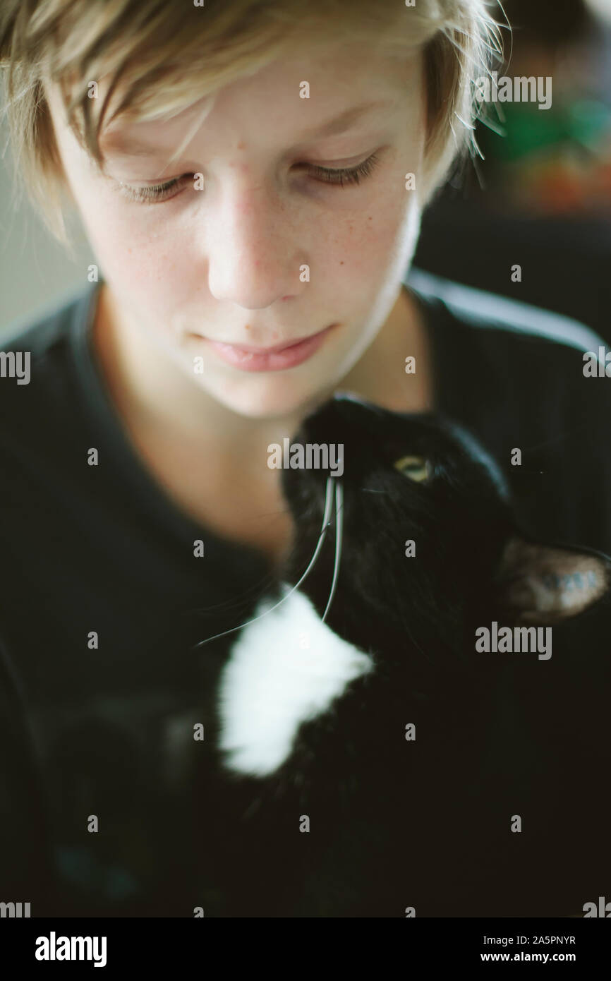 Boy with cat Stock Photo - Alamy