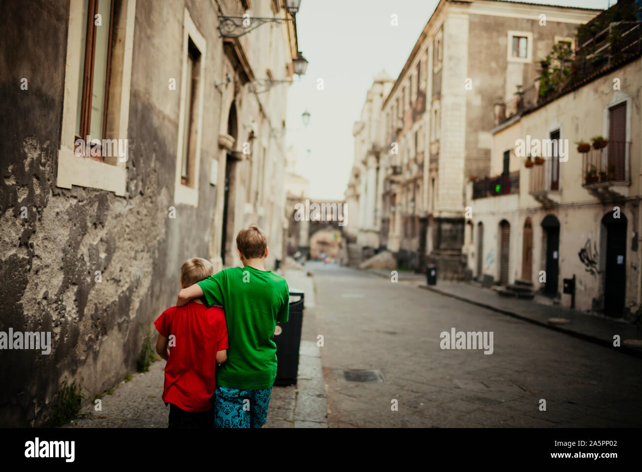 Two boys walking street hi-res stock photography and images - Alamy