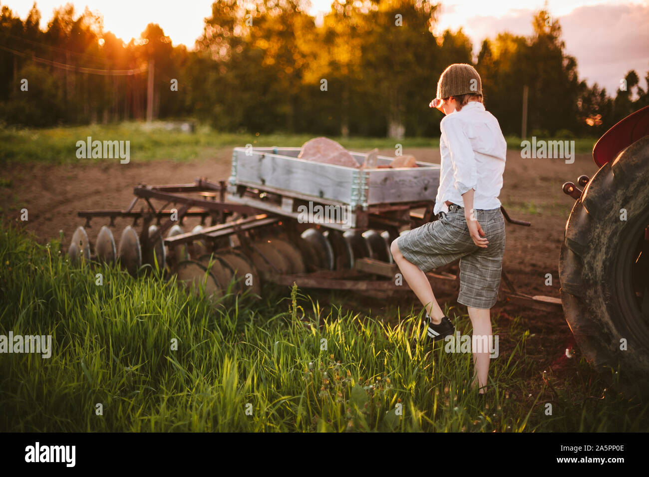 Boy plowing field hi-res stock photography and images - Alamy