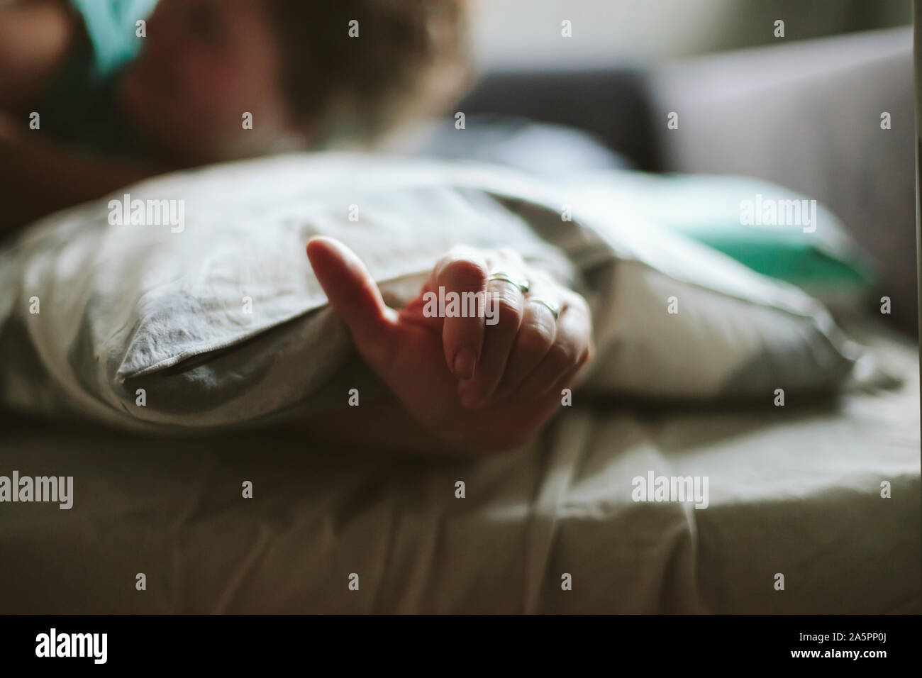 Hand of sleeping person Stock Photo - Alamy