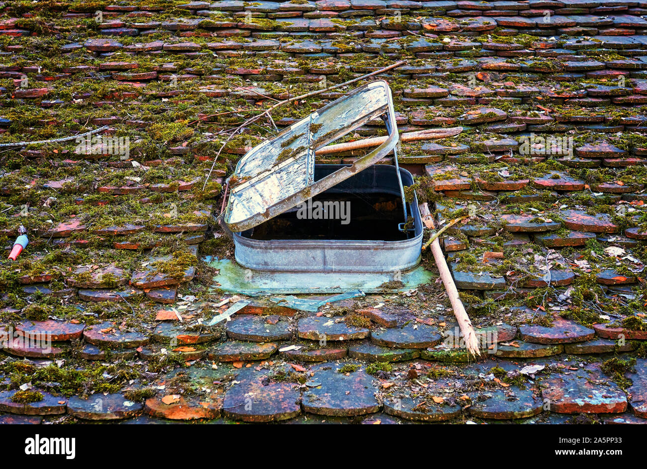 Old window on a roof with rotted roof tiles Stock Photo - Alamy