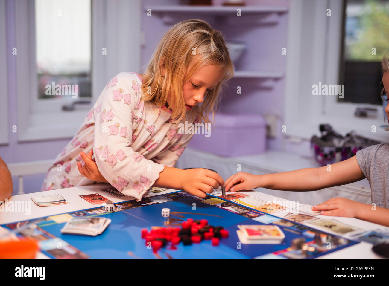 Girl playing board game hi-res stock photography and images - Alamy