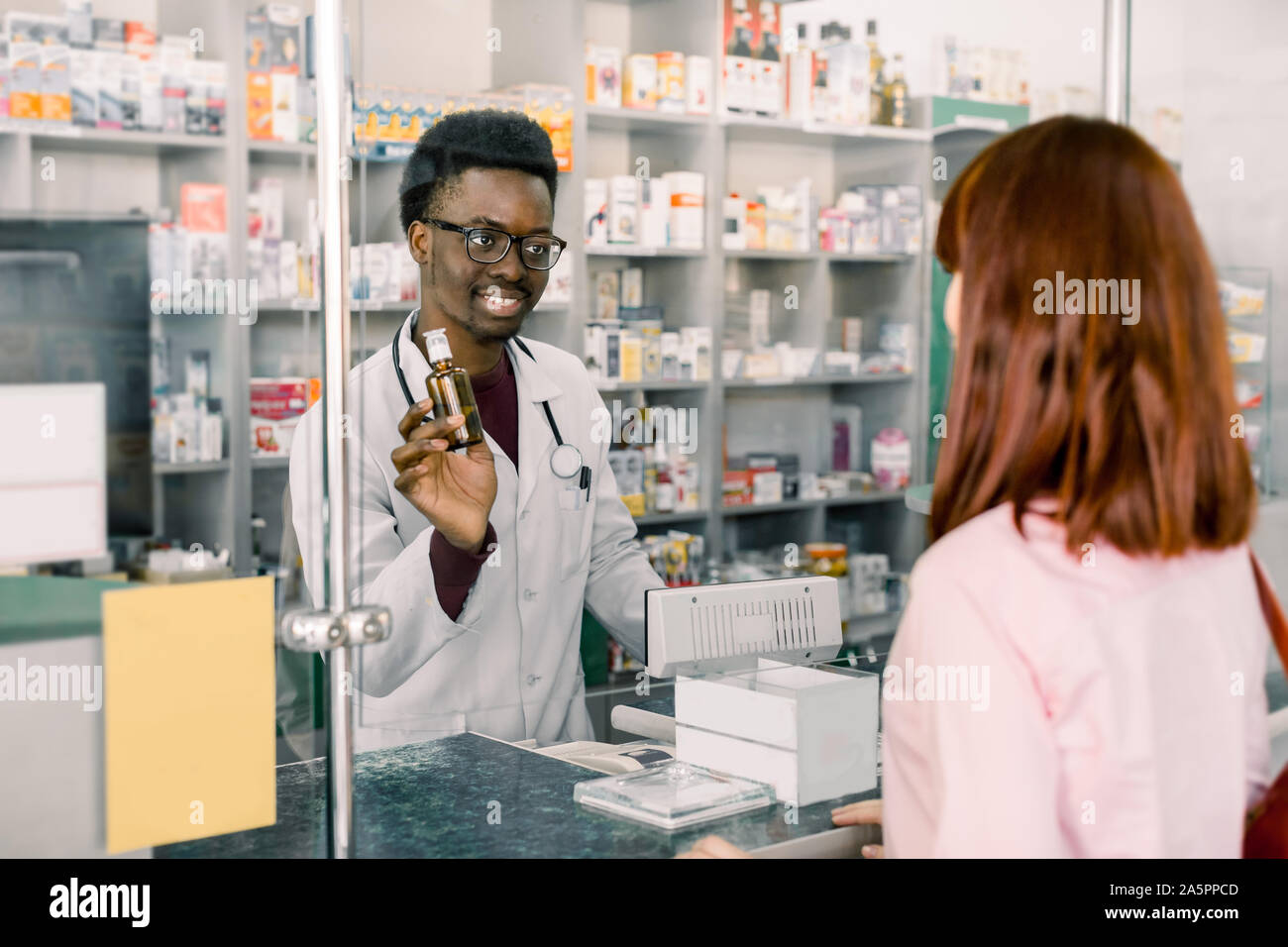 medicine, pharmaceutics, health care and people concept - happy young ...