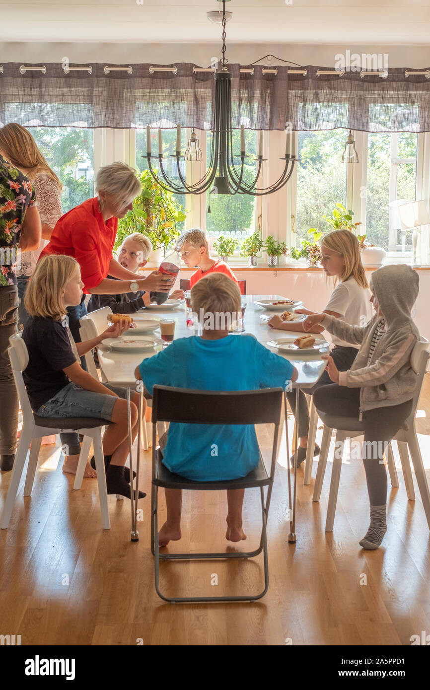 Big caucasian family sitting table hi-res stock photography and images ...