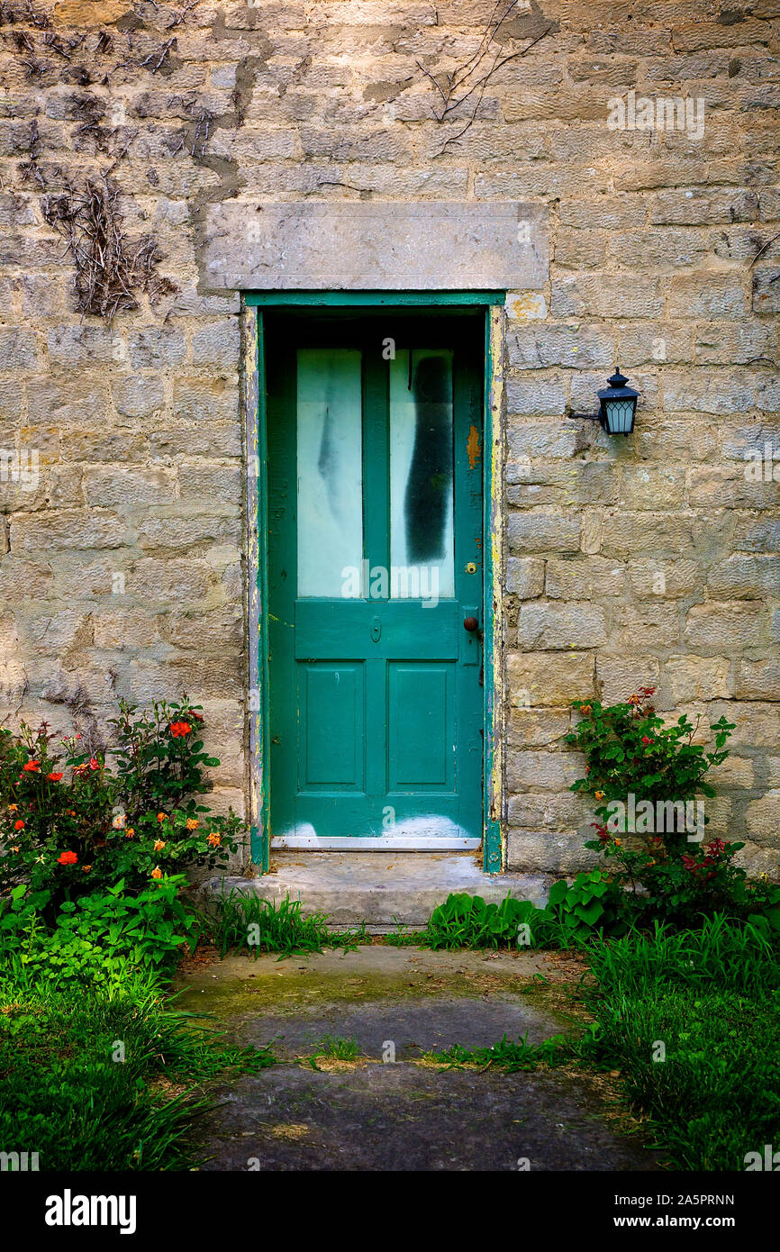 Door to an old limestone house Stock Photo - Alamy