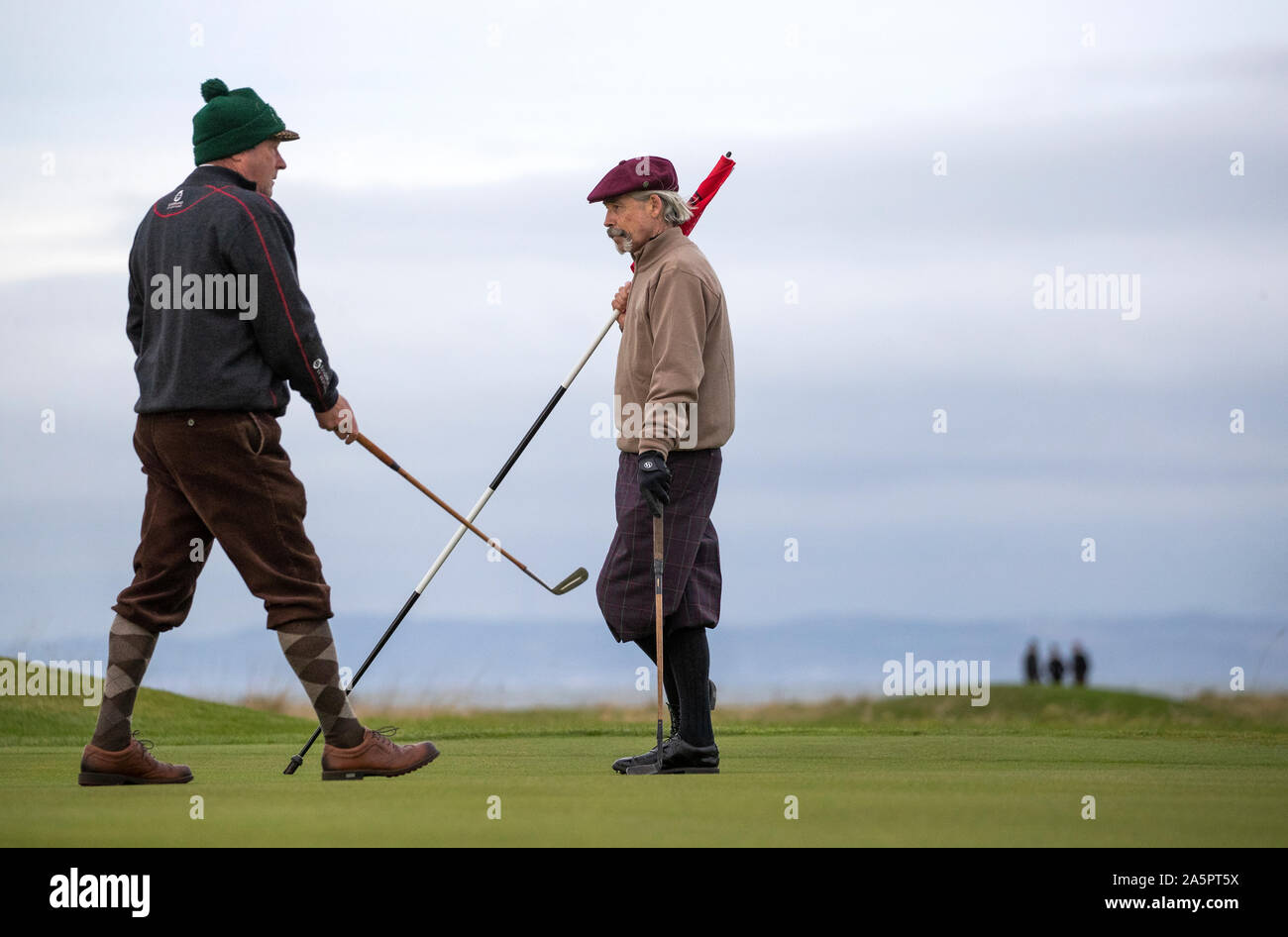 Golfter David Kirkham (centre) on the 18th green during the World ...