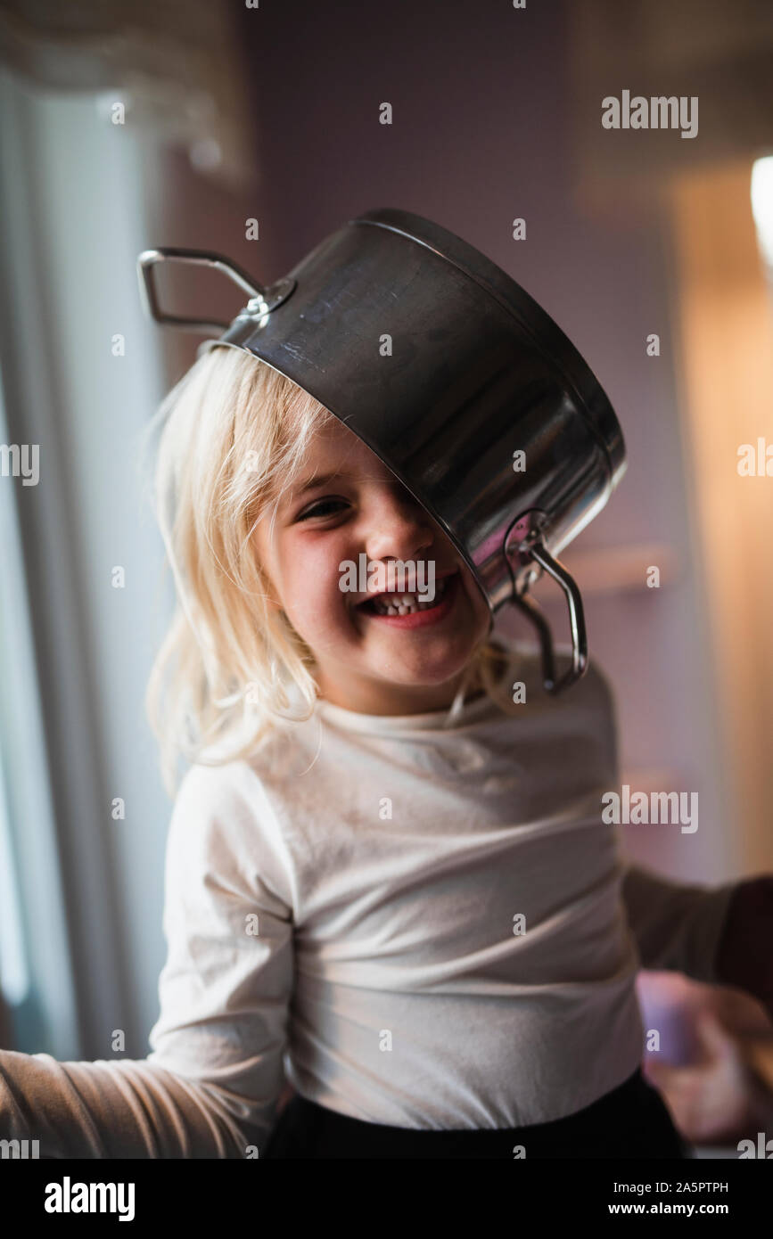 Girl wearing pot on head Stock Photo - Alamy