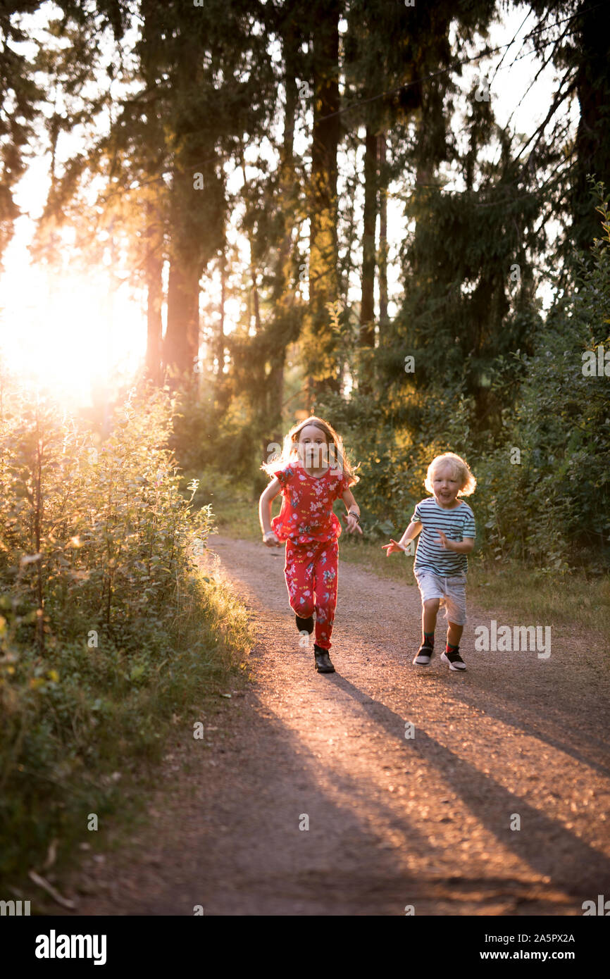 Two girls running through forest hi-res stock photography and images ...