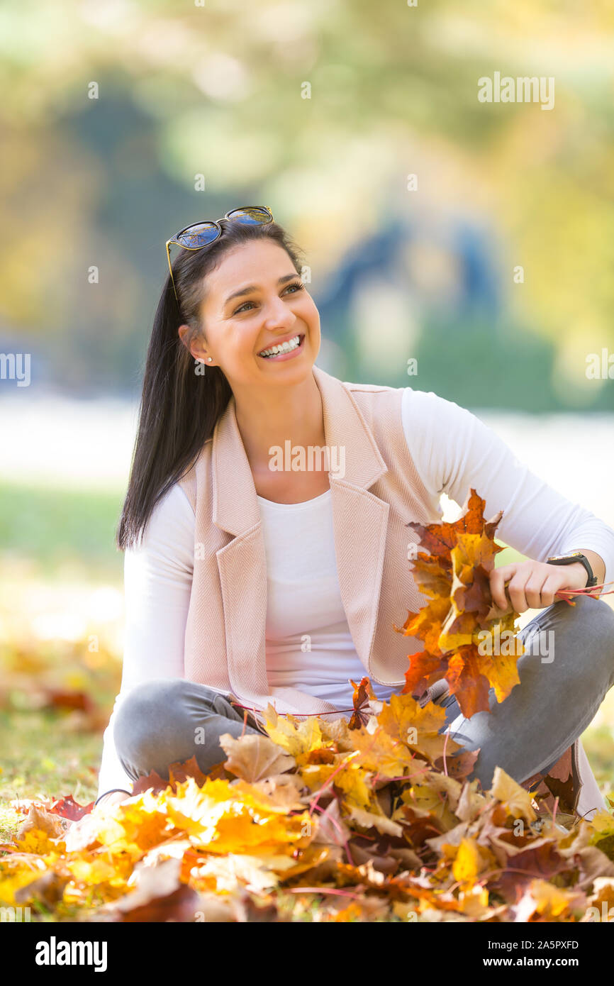Elegant lady in fall park hi-res stock photography and images - Alamy