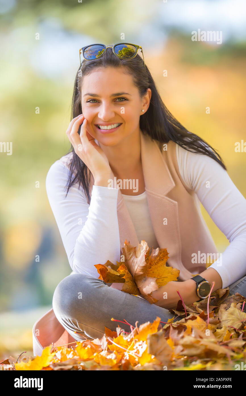 Elegant lady in fall park hi-res stock photography and images - Alamy