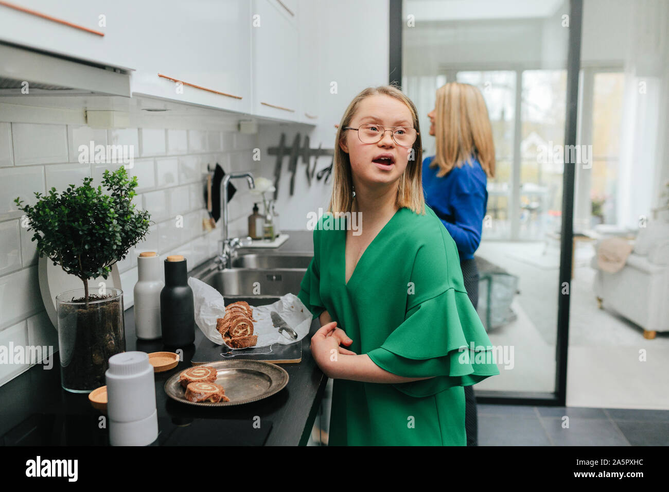 Teenage girl in kitchen Stock Photo - Alamy