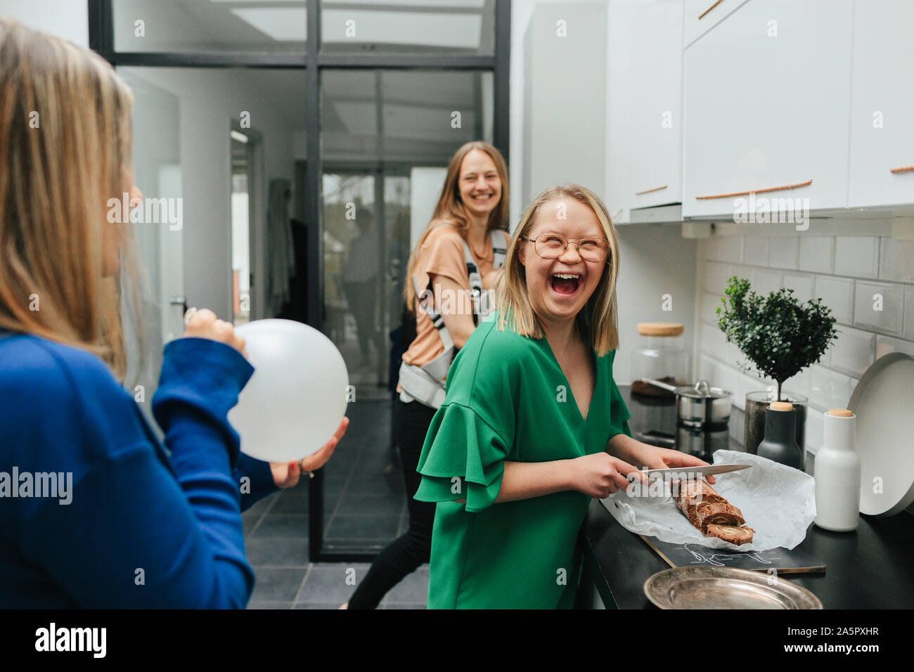 Happy teenage girl in kitchen Stock Photo - Alamy
