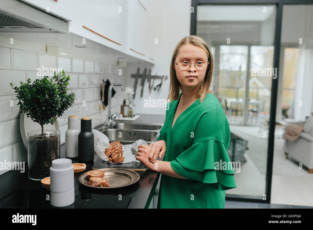 Teenage girl in kitchen Stock Photo - Alamy