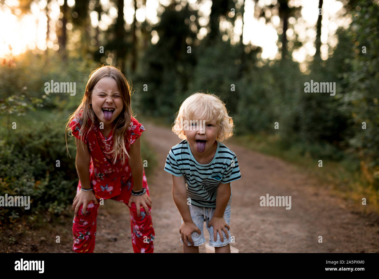 Kids sticking tongues out Stock Photo - Alamy
