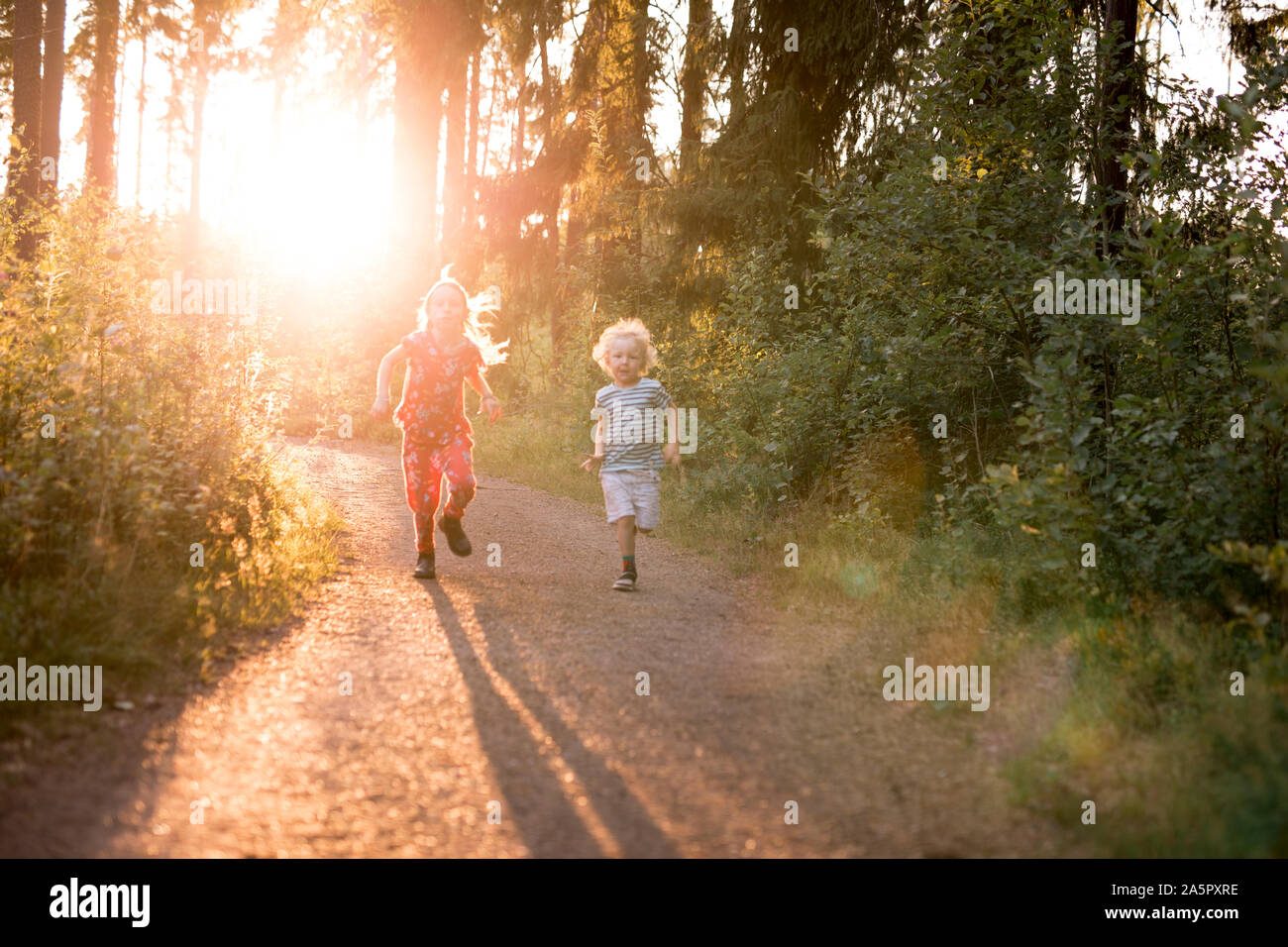 Back view of two girls running hi-res stock photography and images - Alamy