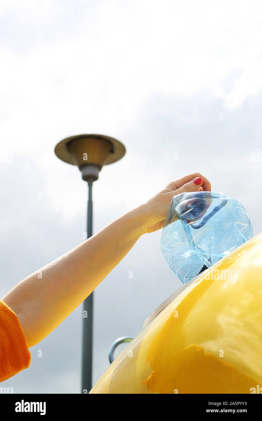 Sorting of waste, segregation of plastic waste into a container Stock ...