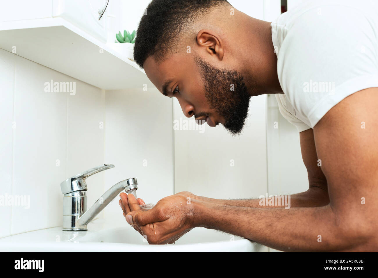 Guy Washing Face