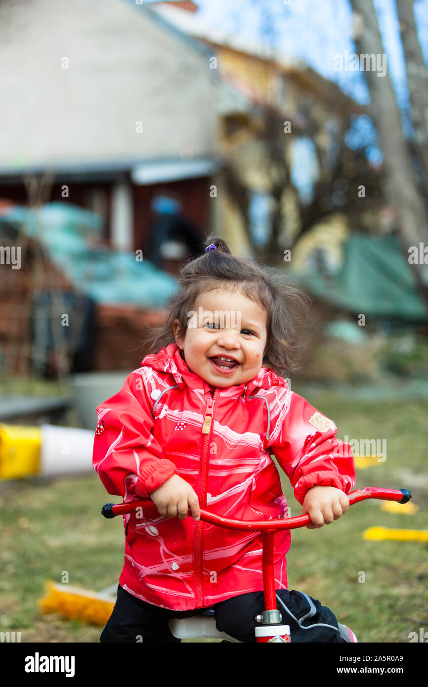 Girl on tricycle hi-res stock photography and images - Alamy