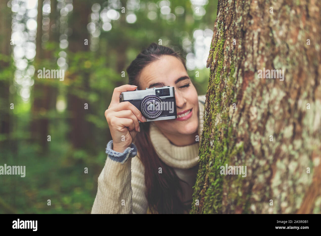 Young female photographer holding hi-res stock photography and images ...