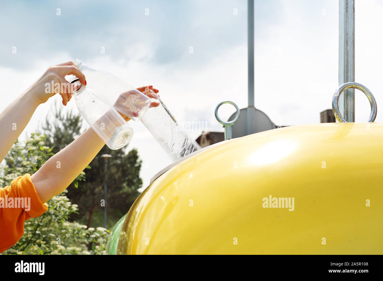 Recycking, segregation of plastic garbage into a container Stock Photo ...
