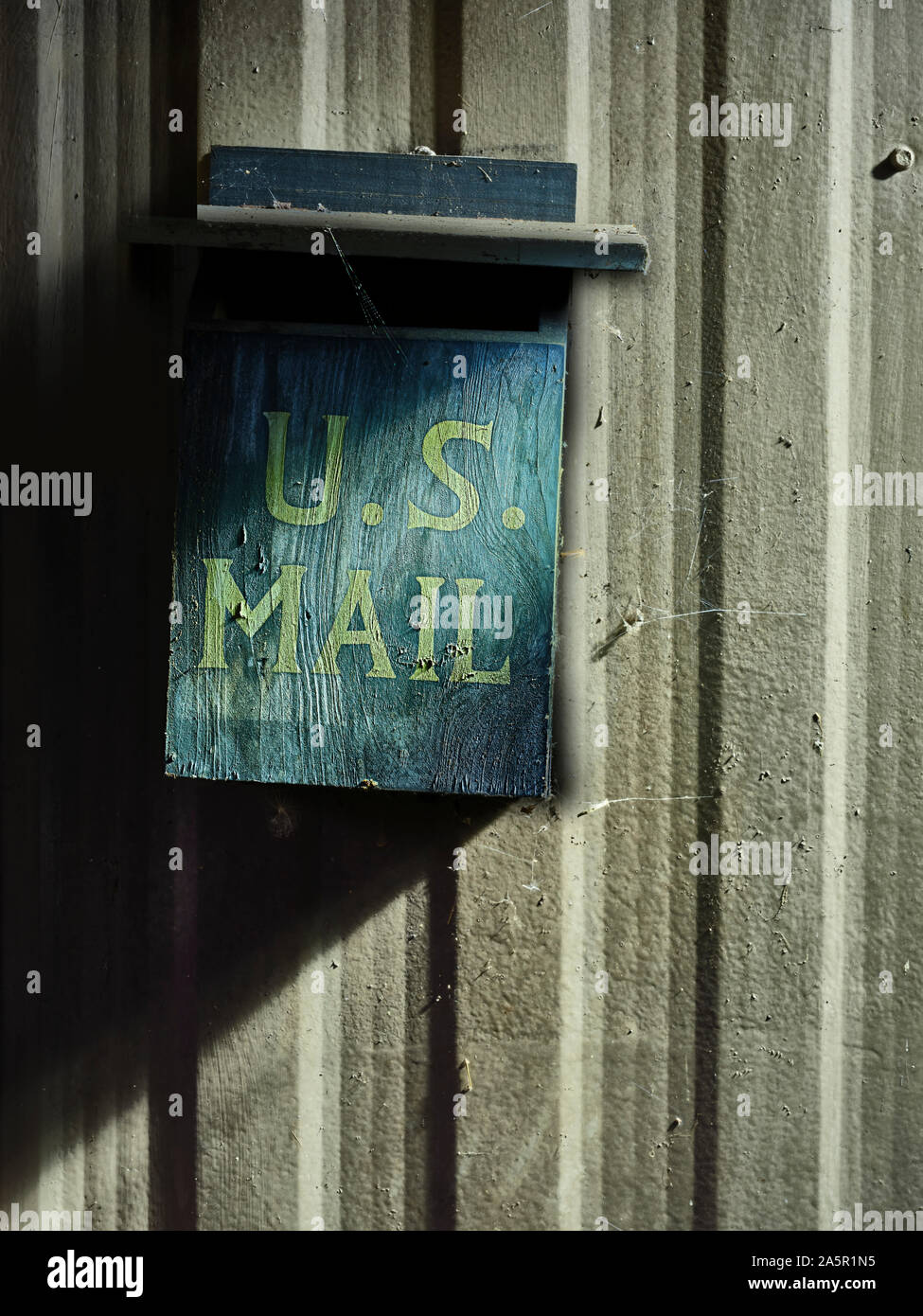 Old rustic US mailbox on side of country home Stock Photo - Alamy