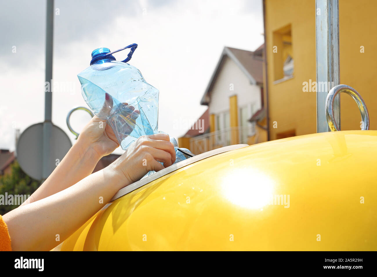 Recycking, segregation of plastic garbage into a container Stock Photo ...